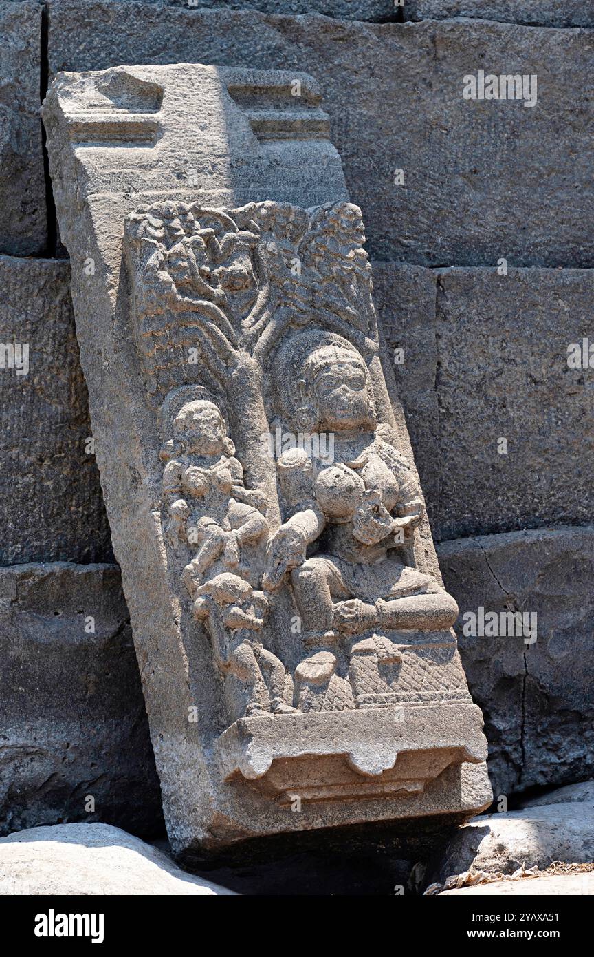 Carved idols on the outer wall of an old temple, near Palasdev Temple ...