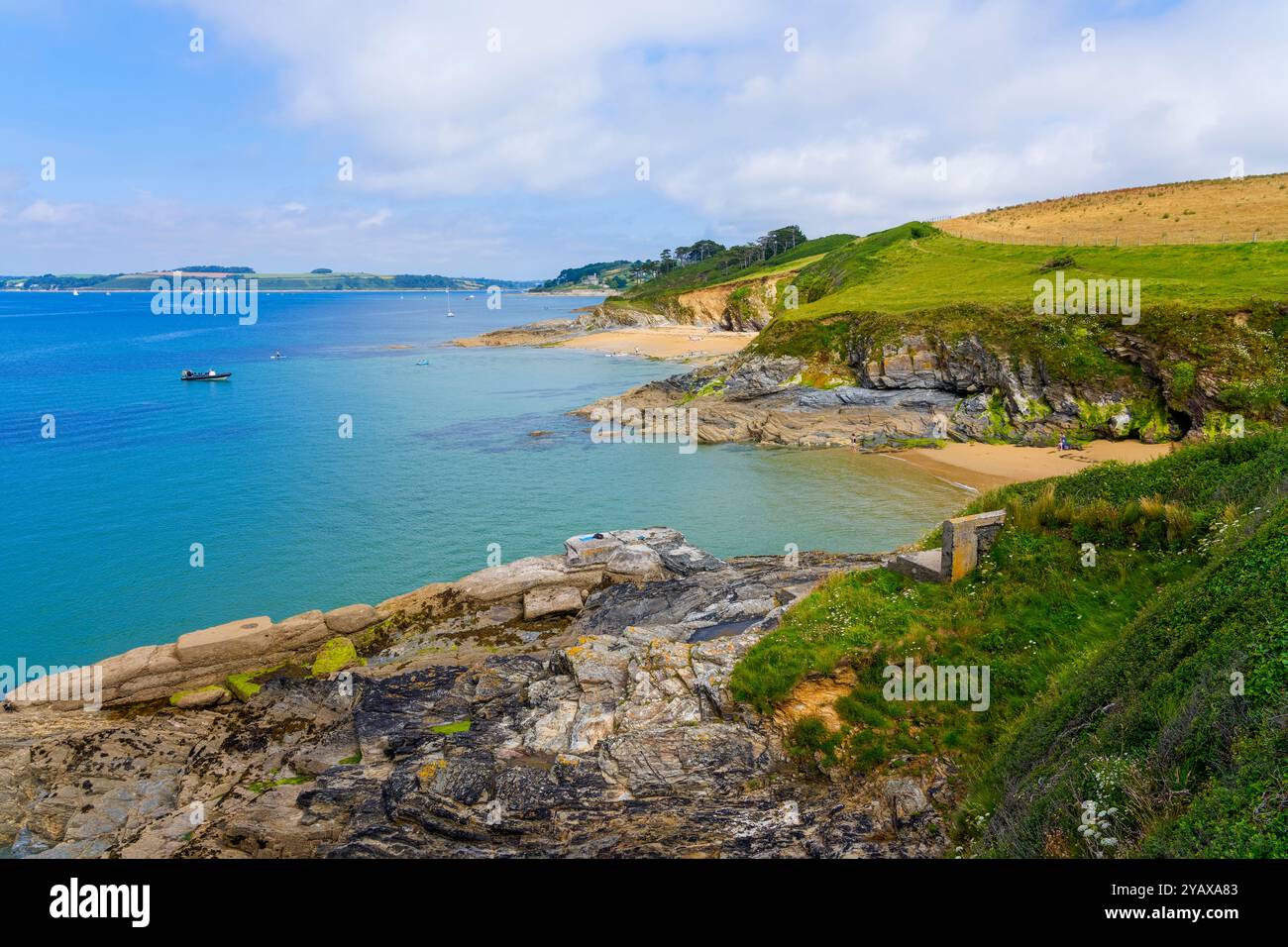 Small secluded beaches nestled under the cliffs of St Anthony Head ...