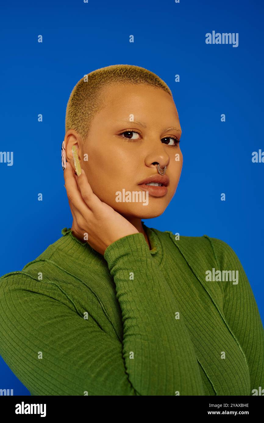 A fashionable young woman showcases her style with a bold expression ...