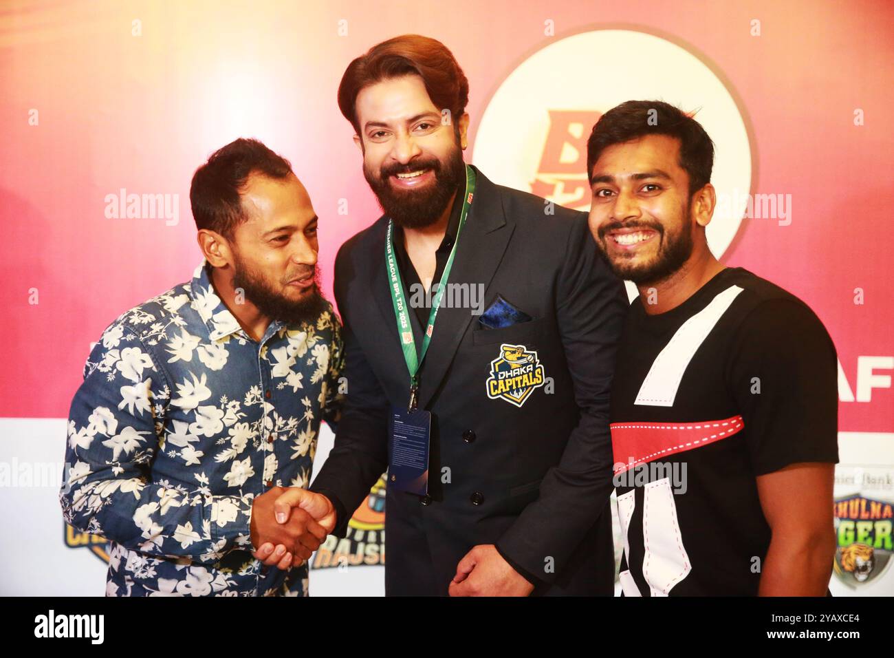 Fortune Barisal player Mushfiqur Rahim (L) and Khulna Tigers player Mehedi Hasan Miraz (R) with ...