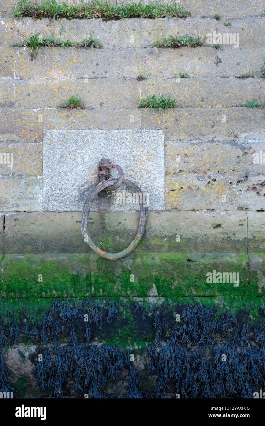 Ramsgate, UK - 11 Oct 2024 - An old rusted mooring cleat in a harbour ...