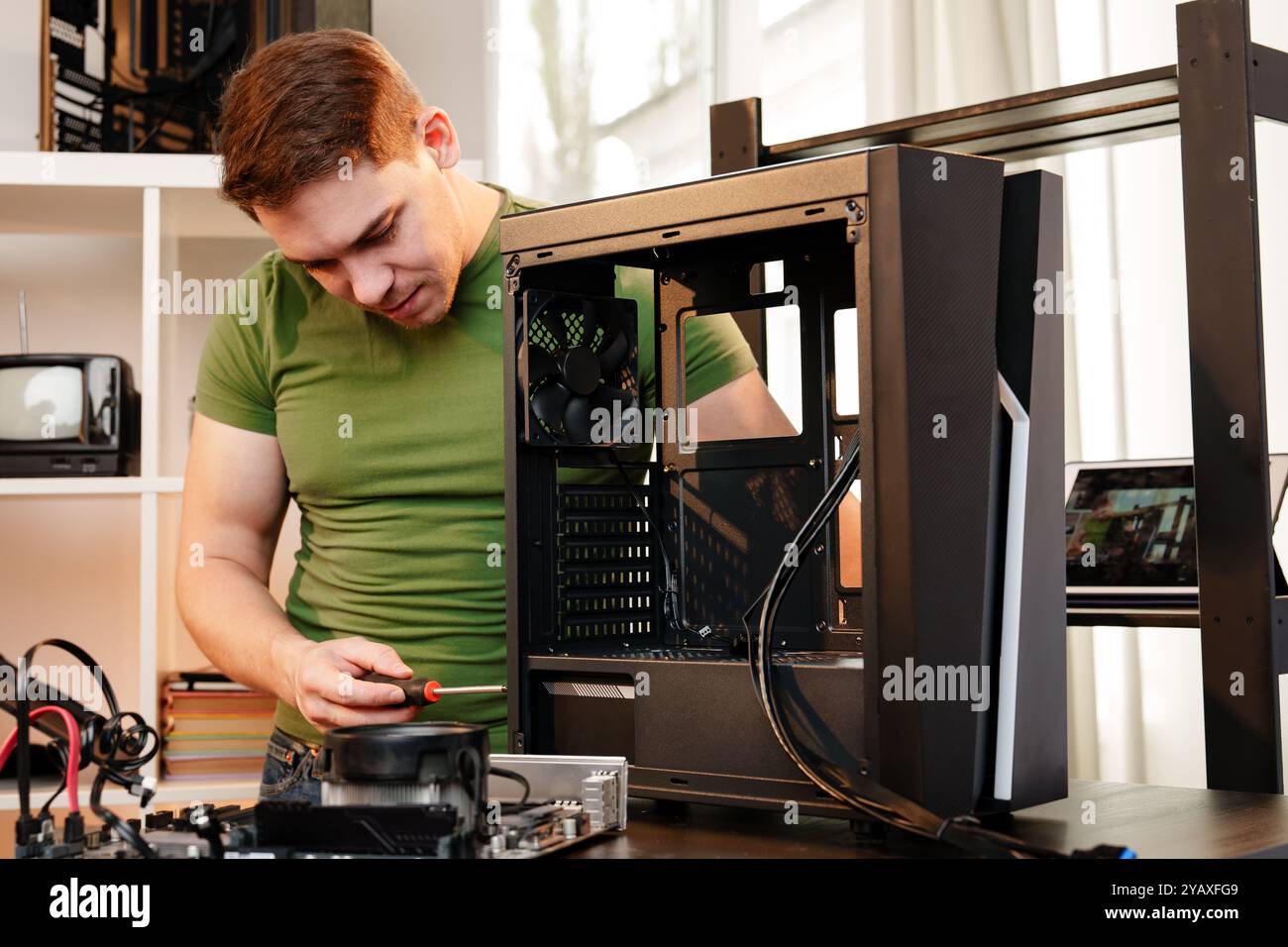 Man assembles a computer system unit at home Stock Photo - Alamy