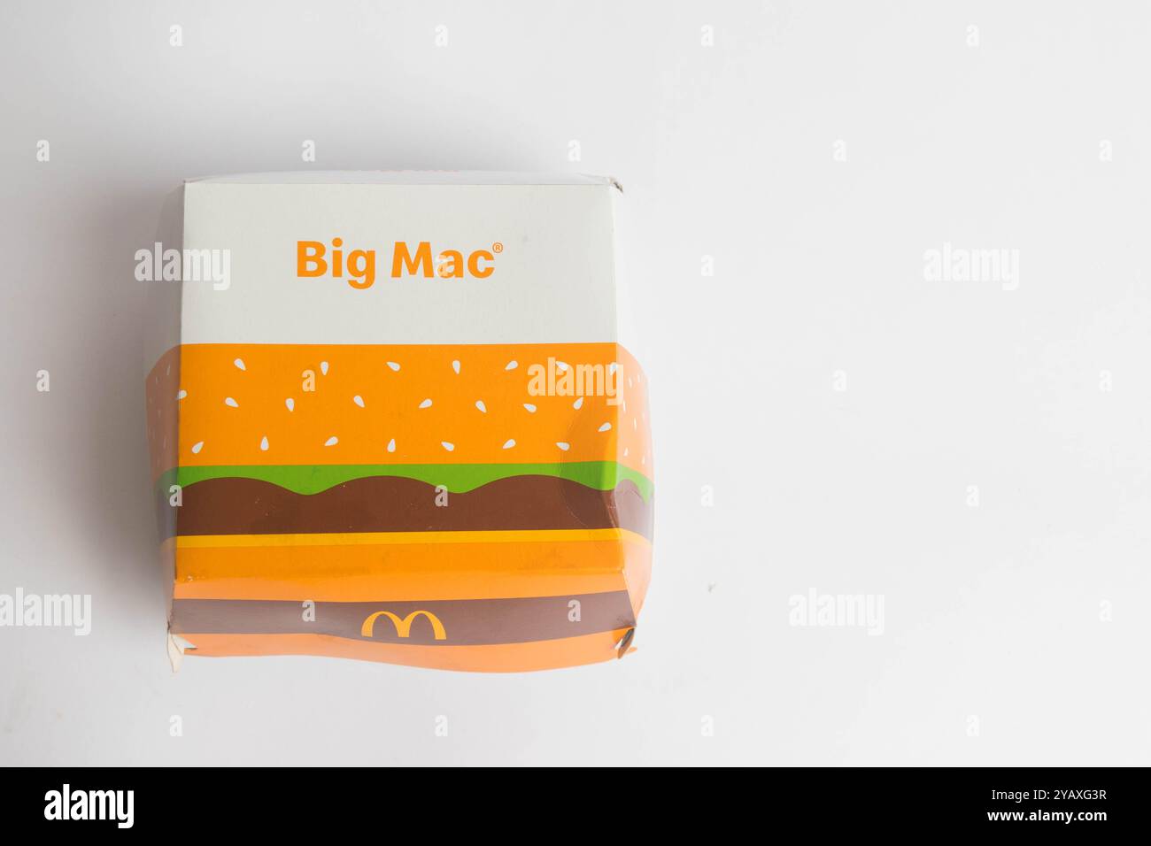 London, United Kingdom, 14th October 2024:- A view of a McDonalds Big Mac Box, against a white ...