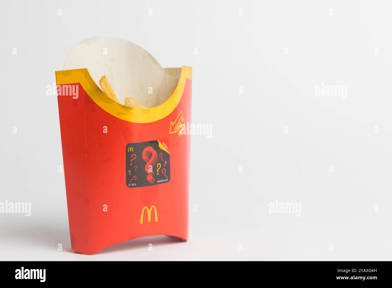 London, United Kingdom, 14th October 2024:- A view of a McDonalds Large Fries, against a white ...