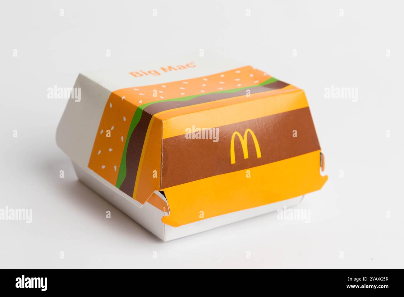 London, United Kingdom, 14th October 2024:- A view of a McDonalds Big Mac Box, against a white ...
