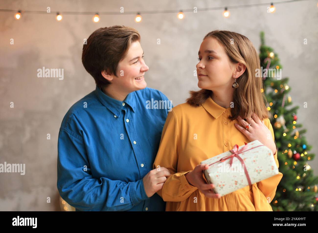 two sisters joyfully exchanging a multitude of beautifully wrapped ...