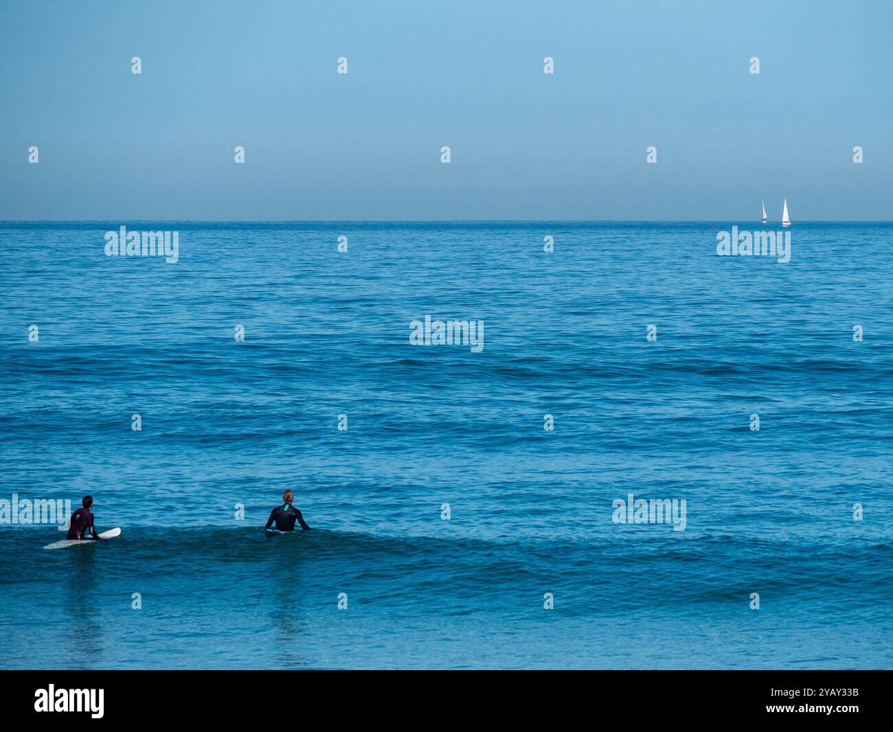 Surfers Waiting For The Wave Stock Photo - Alamy