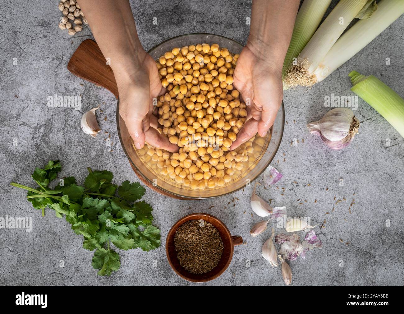 A selection of fresh ingredients, including chickpeas, herbs, and ...