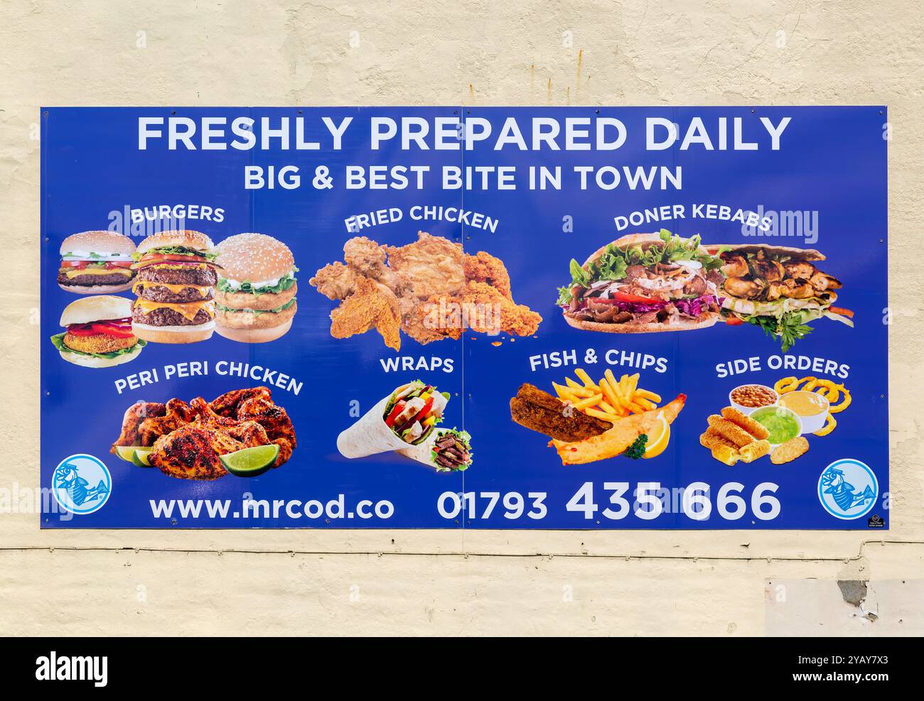 Large advertising poster for fast-food on wall of takeaway restaurant ...