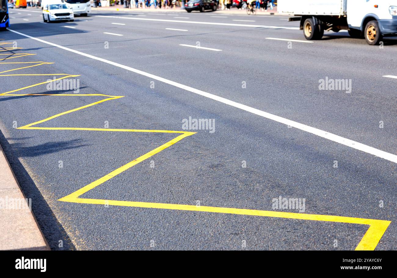Road markings of a city street for public transport stops in summer ...
