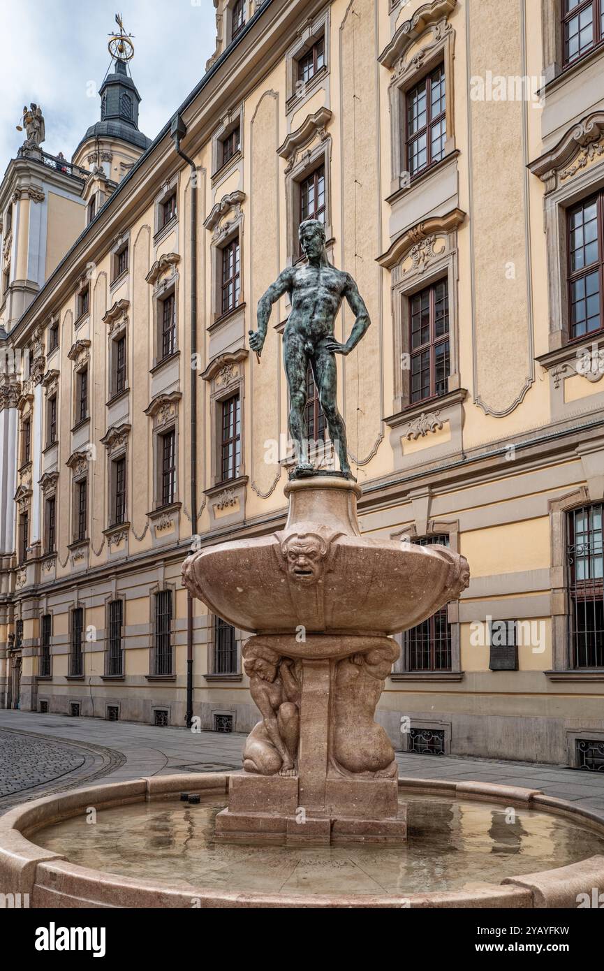 A detailed stone fountain featuring a classical statue, situated in ...