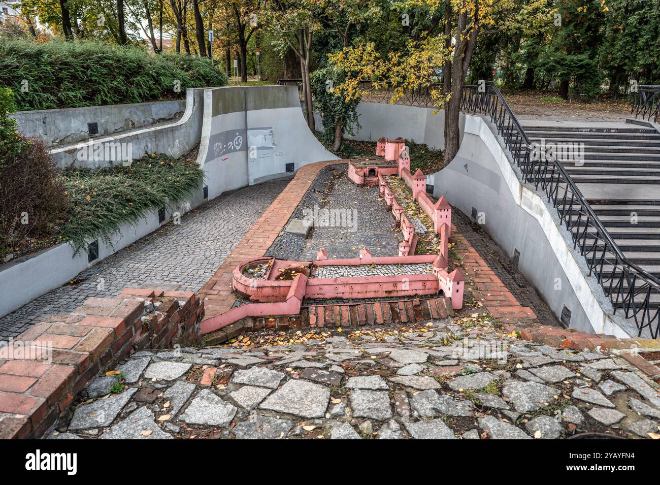 A unique miniature model structure in an urban park. Surrounded by ...