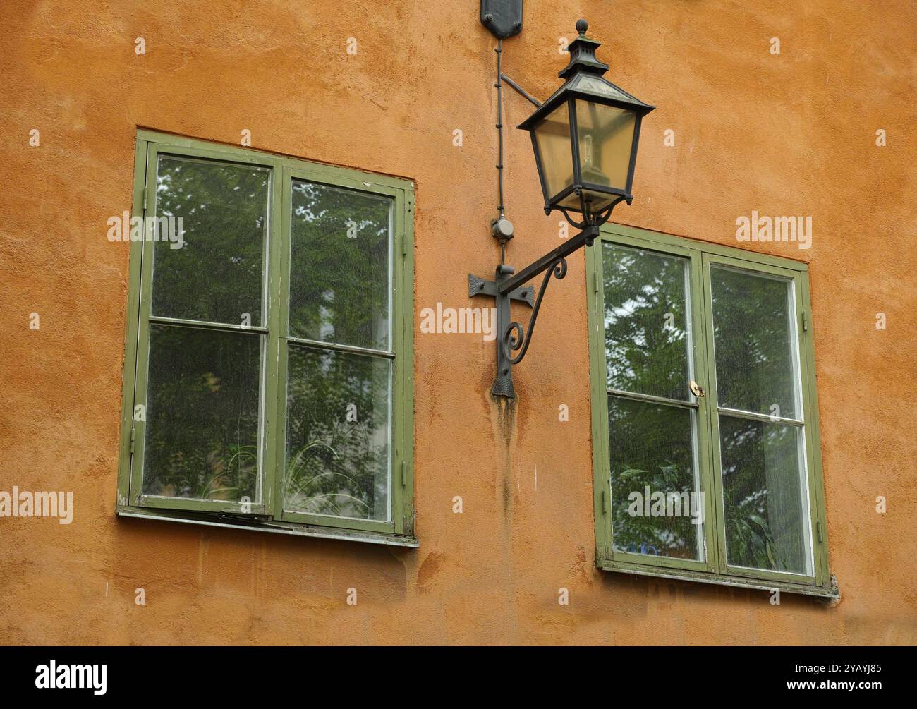 Vintage home, building and window in city with lamp, grunge wall and ...