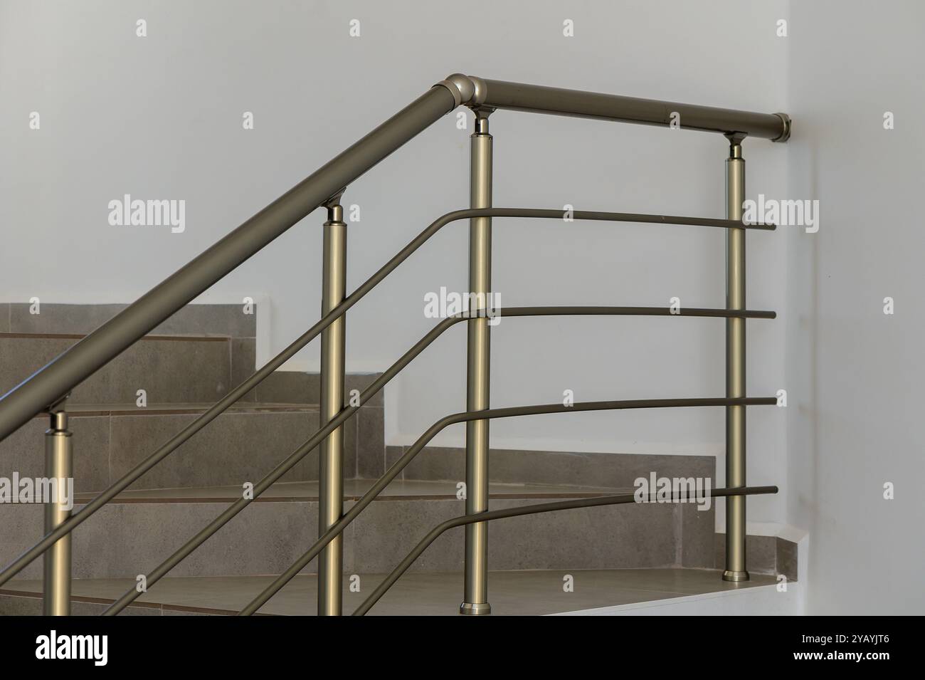 A sleek and stylish stair railing catches the eye in a modern home ...