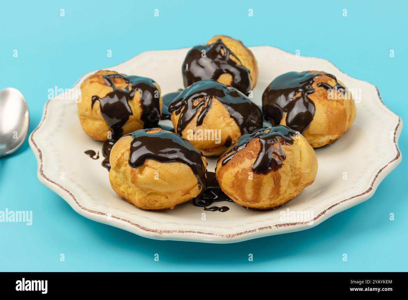 Plate chocolate profiteroles close hi-res stock photography and images ...