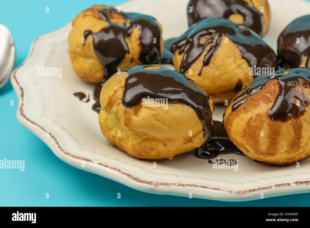 Plate chocolate profiteroles close hi-res stock photography and images ...