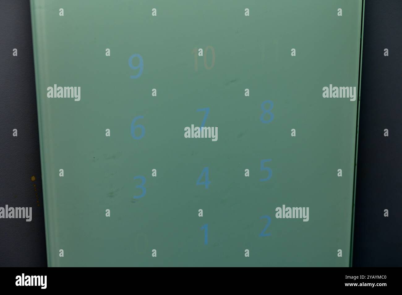 A sleek keypad glows softly, displaying numbers in a captivating blue ...