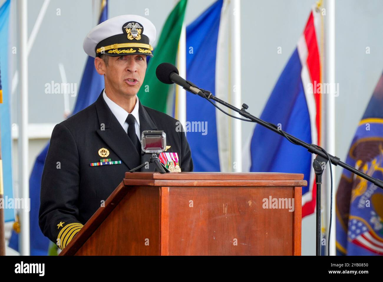 Captain Teague Suarez addresses the USS Oscar Austin on its arrival at ...