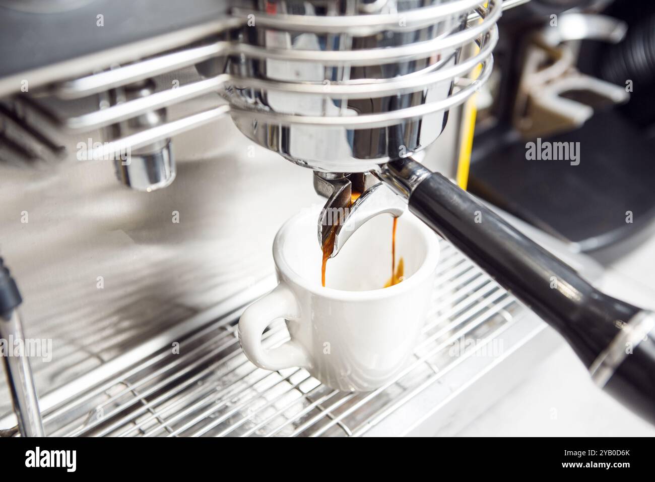Close-Up View of Espresso Being Extracted From Machine Into White Cup ...