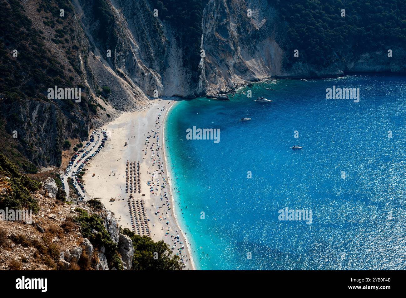 Tropical beach view with crystal clear water with tourist people on the ...