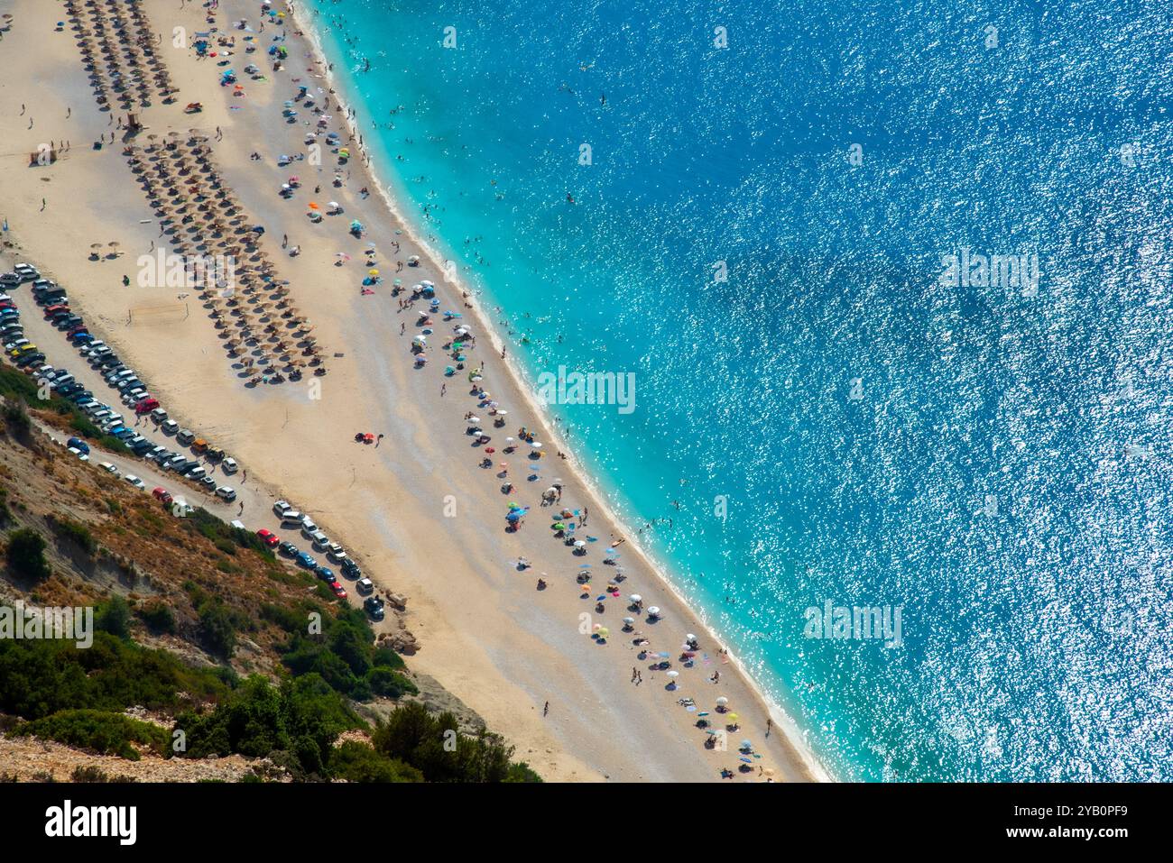 Tropical beach view with crystal clear water with tourist people on the ...