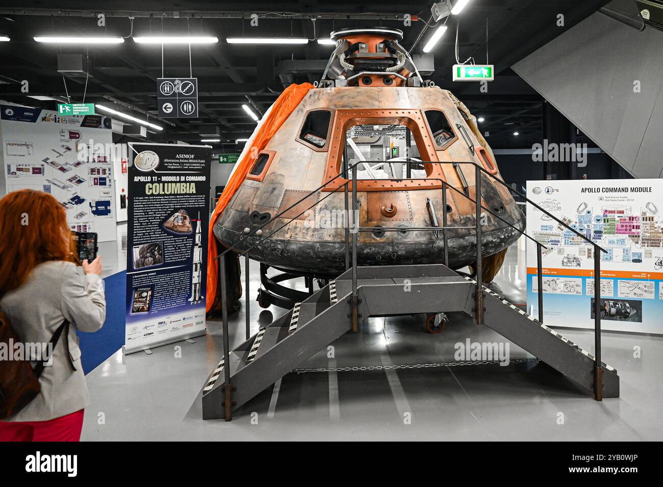A visitor looks at a model of the Apollo 11 Command Module Columbia on ...