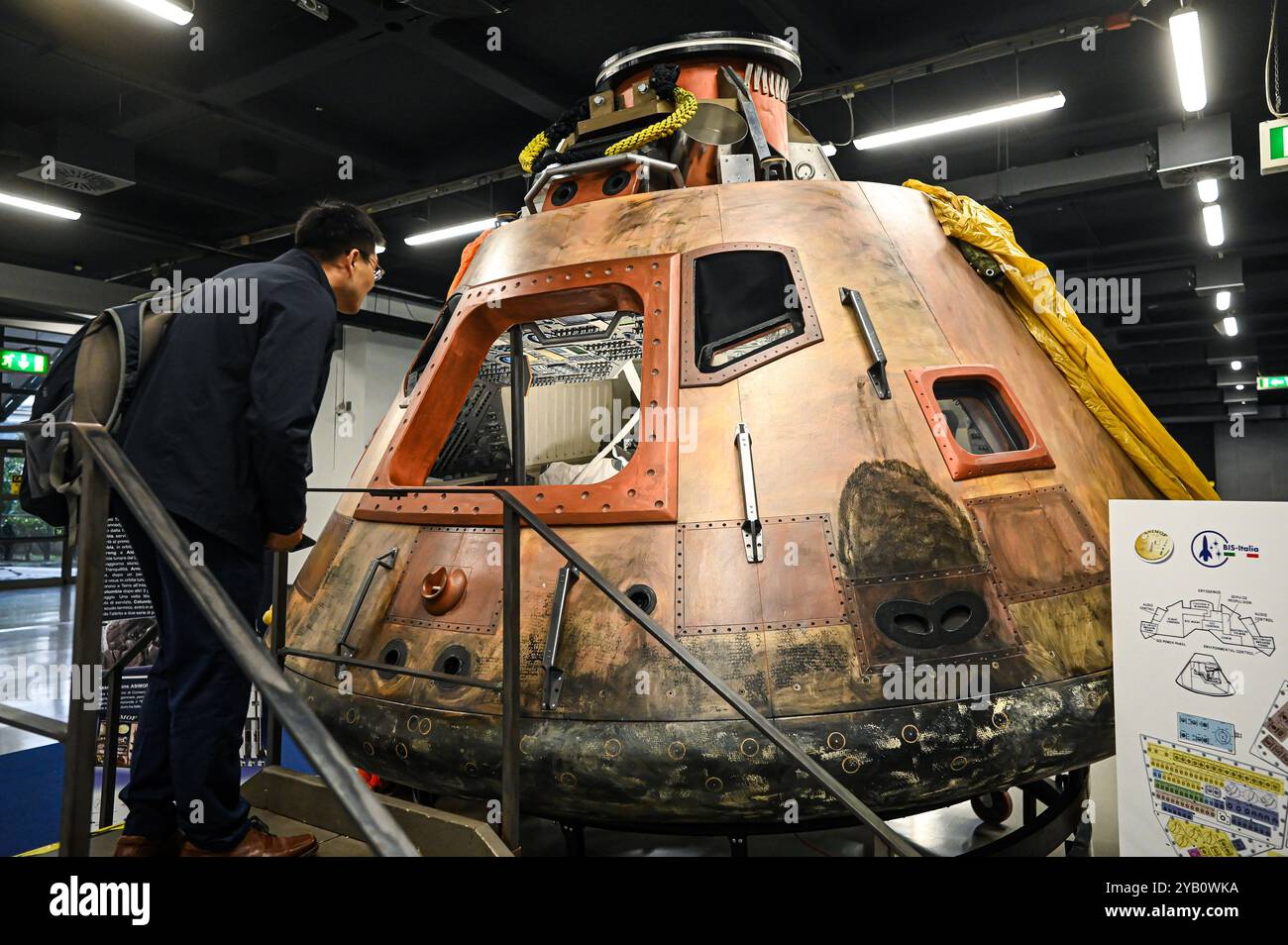 A visitor looks inside a model of the Apollo 11 Command Module Columbia ...