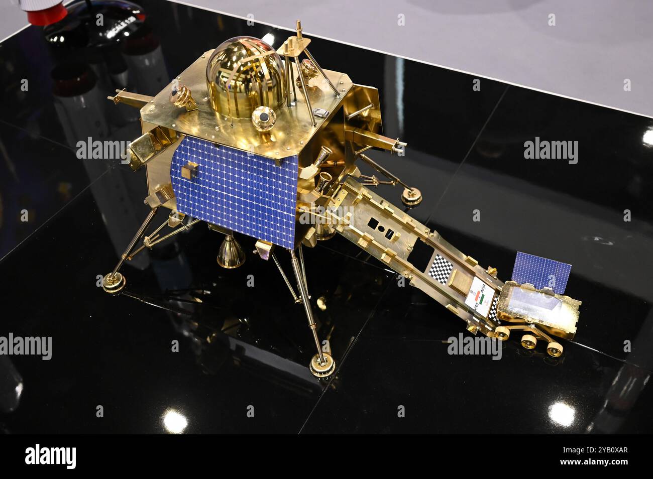 a model of a moon lander and rover is on display at the Indian Space ...