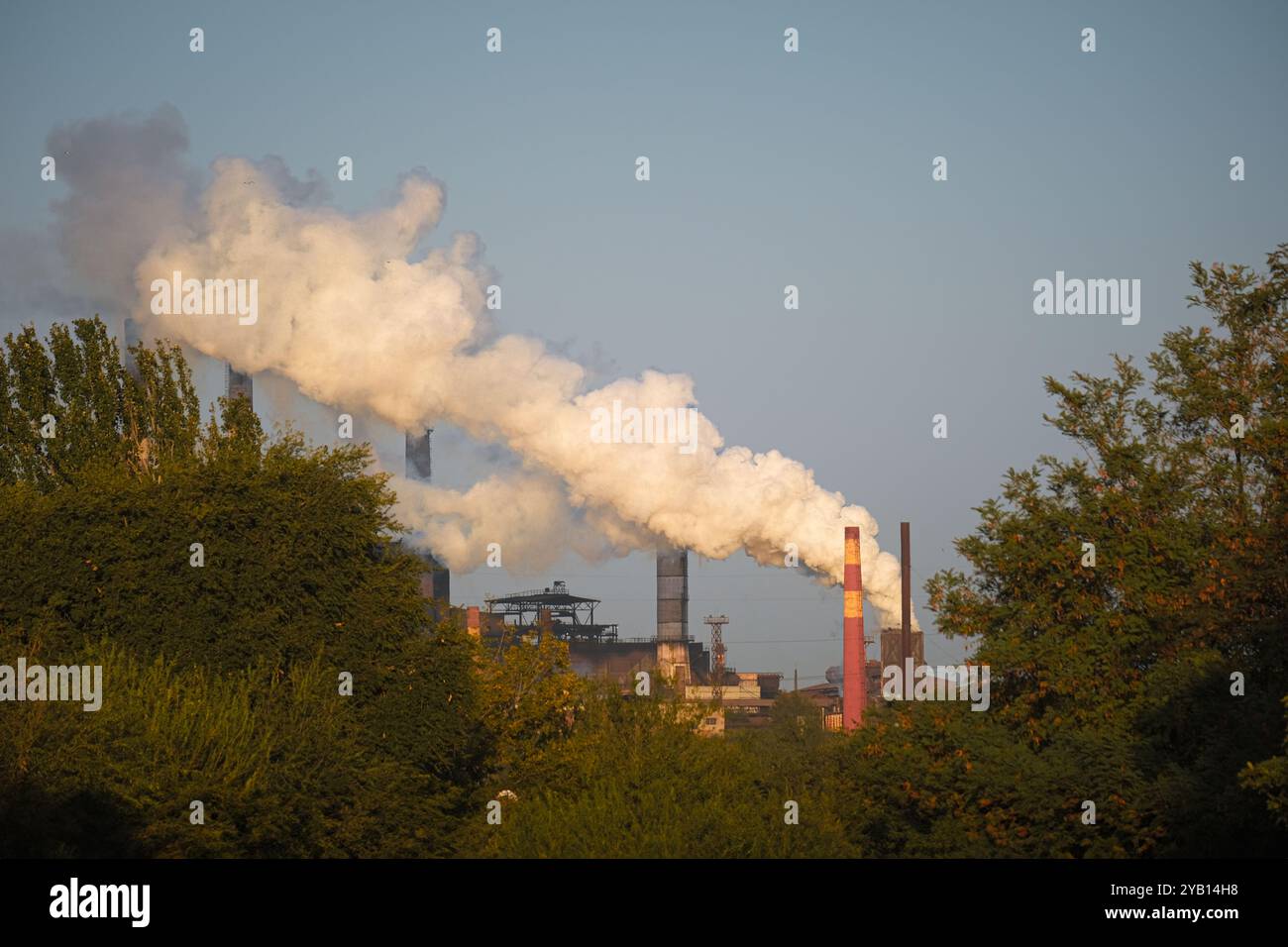 Thick smoke billows from an industrial facility, raising significant ... Thick smoke billows from an industrial facility, raising significant ...