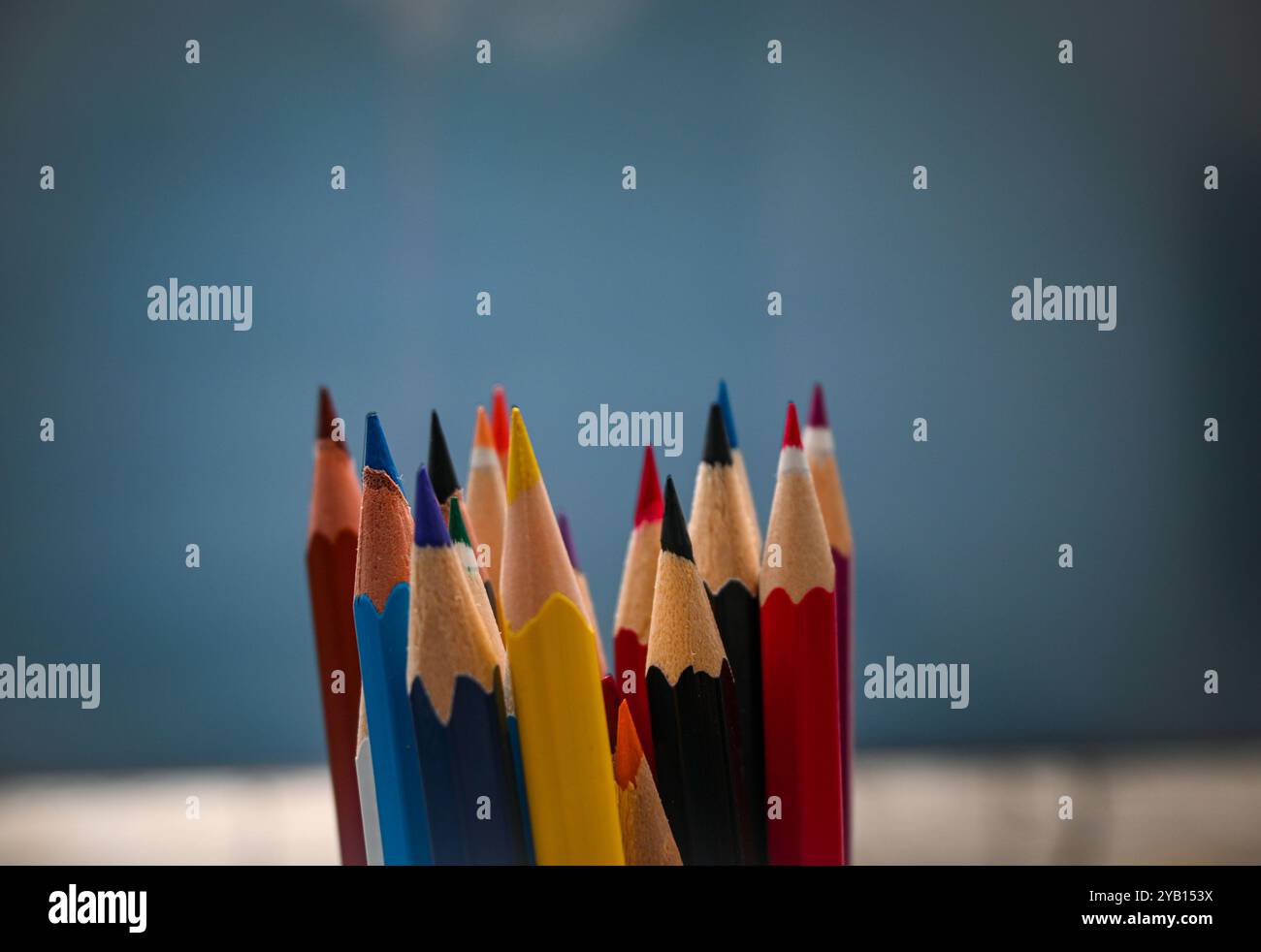 Bunch of colored pencils standing upright is showing its sharpened ...