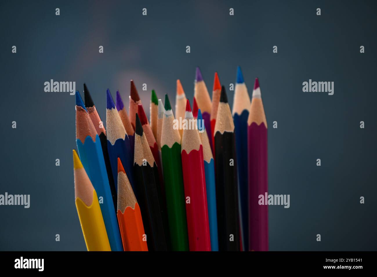 Bunch of colored pencils standing upright is showing its sharpened ...