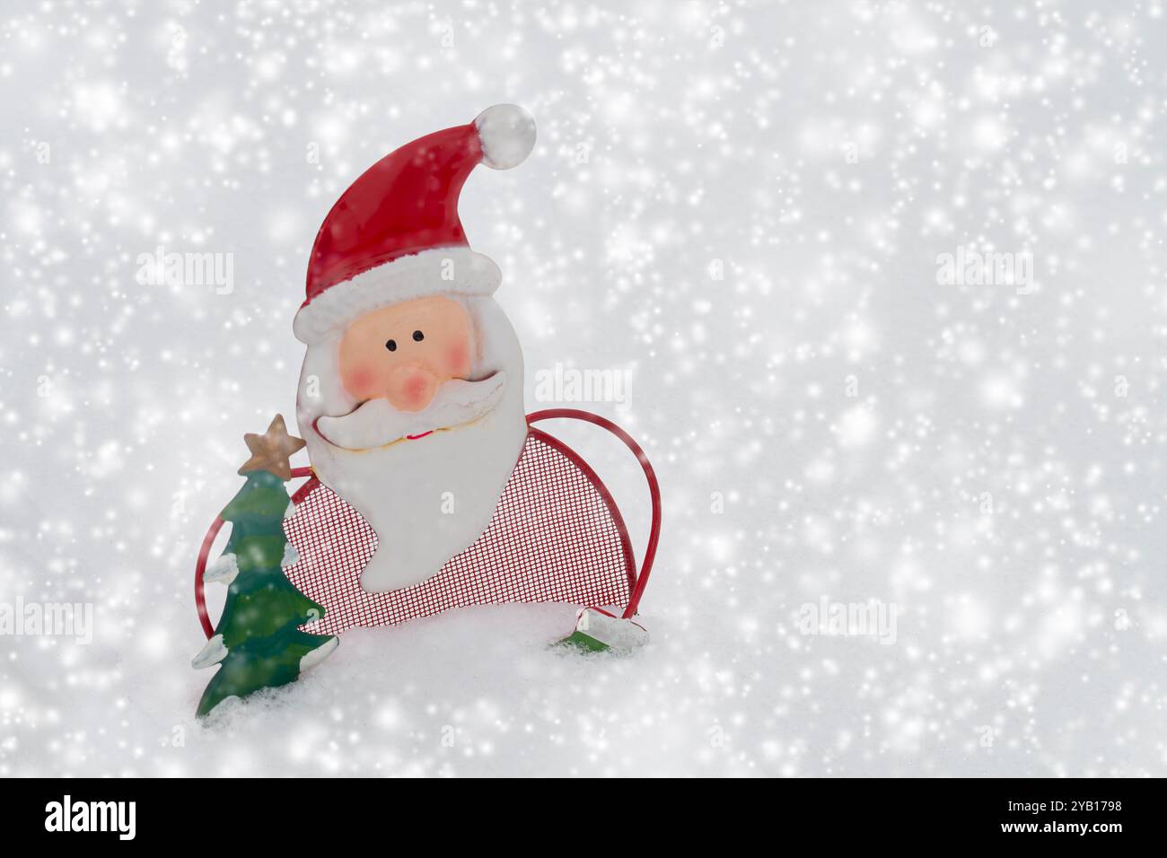 Metal Santa decoration outside in the snow Stock Photo - Alamy