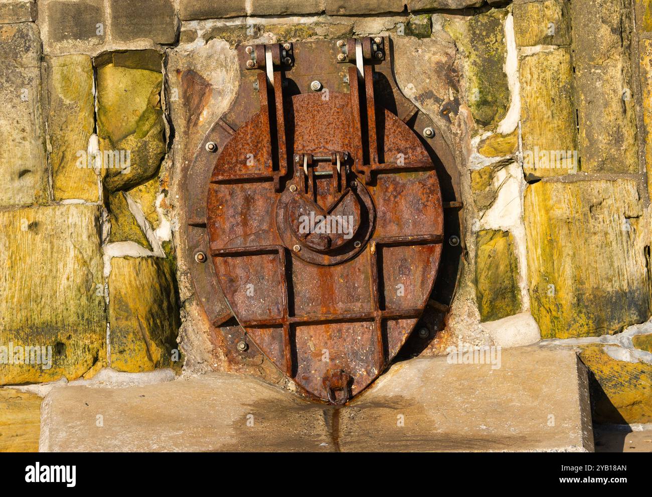 An old corroded strom drain outlet in the seawall on Scarborough ...