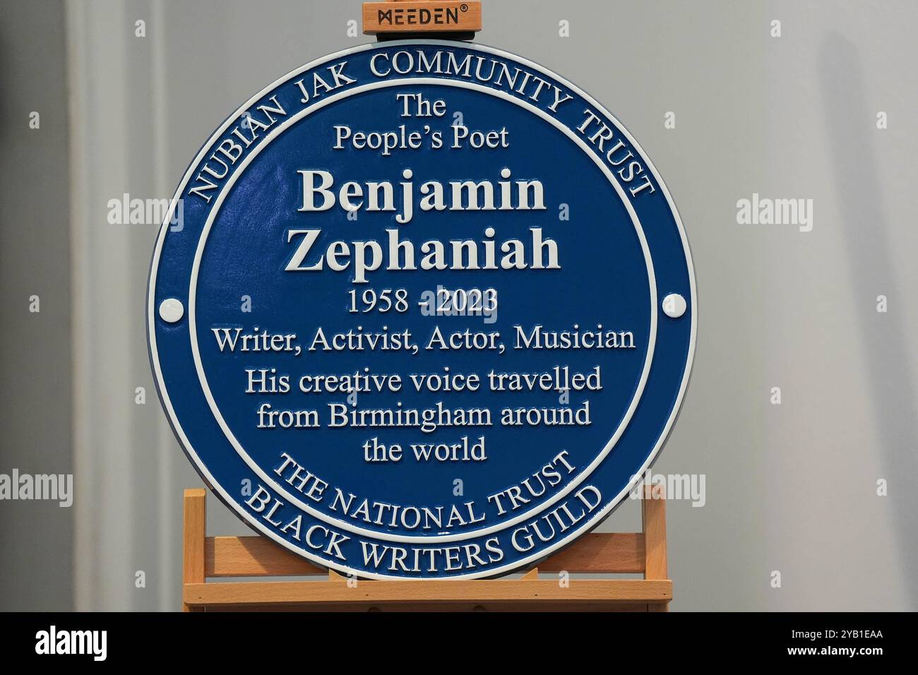 A blue plaque commemorating poet Benjamin Zephaniah during a ceremony ...