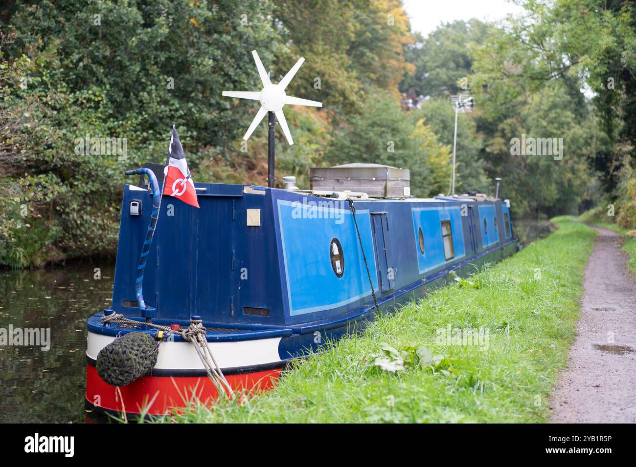 Rear view of a home canal boat with a tv aerial mast mounted at the ...
