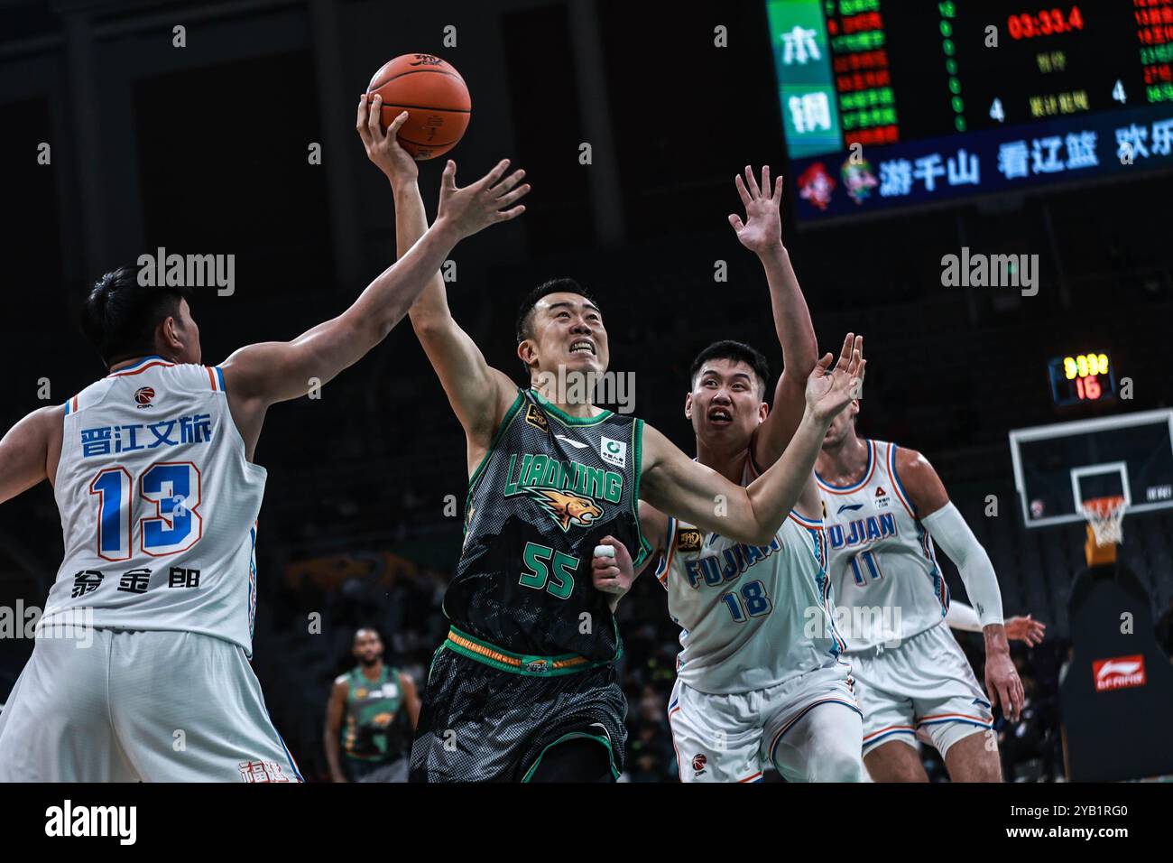 Shenyang. 16th Oct, 2024. Han Dejun (C) of Liaoning Flying Leopards ...
