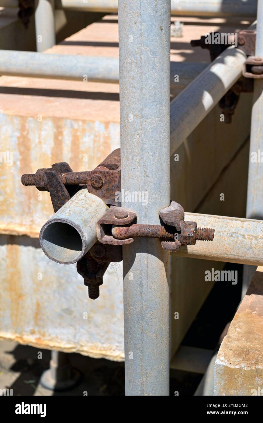 Close up view of the metal connection brackets and bolts on scaffolding ...
