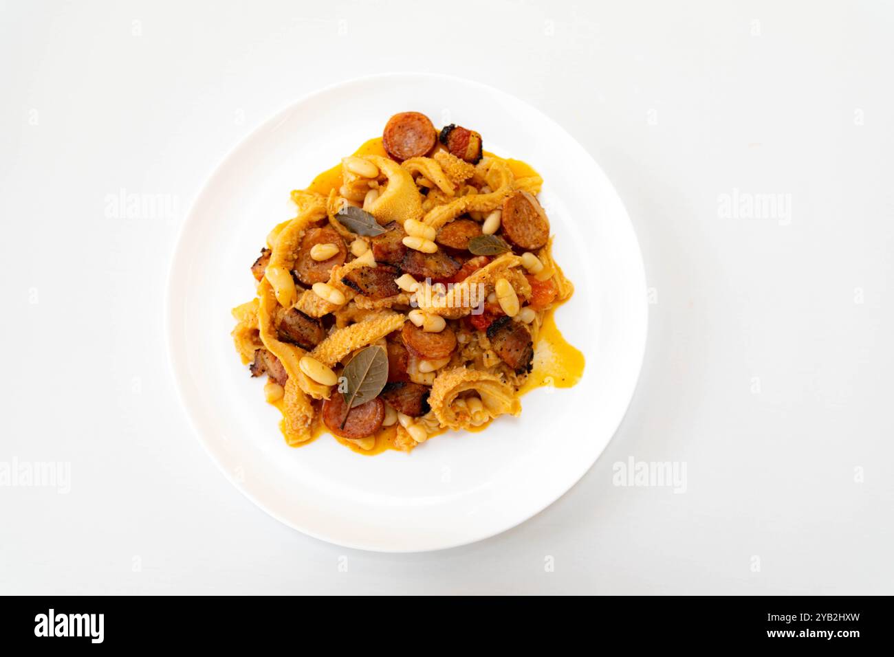 Beef tripe (bucho), beef stomach, tripe on a white plate. Dobradinha ...
