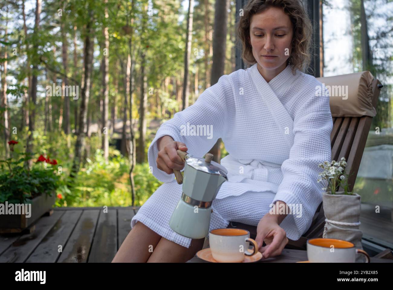 Woman sipping mug in cabin hi-res stock photography and images - Alamy