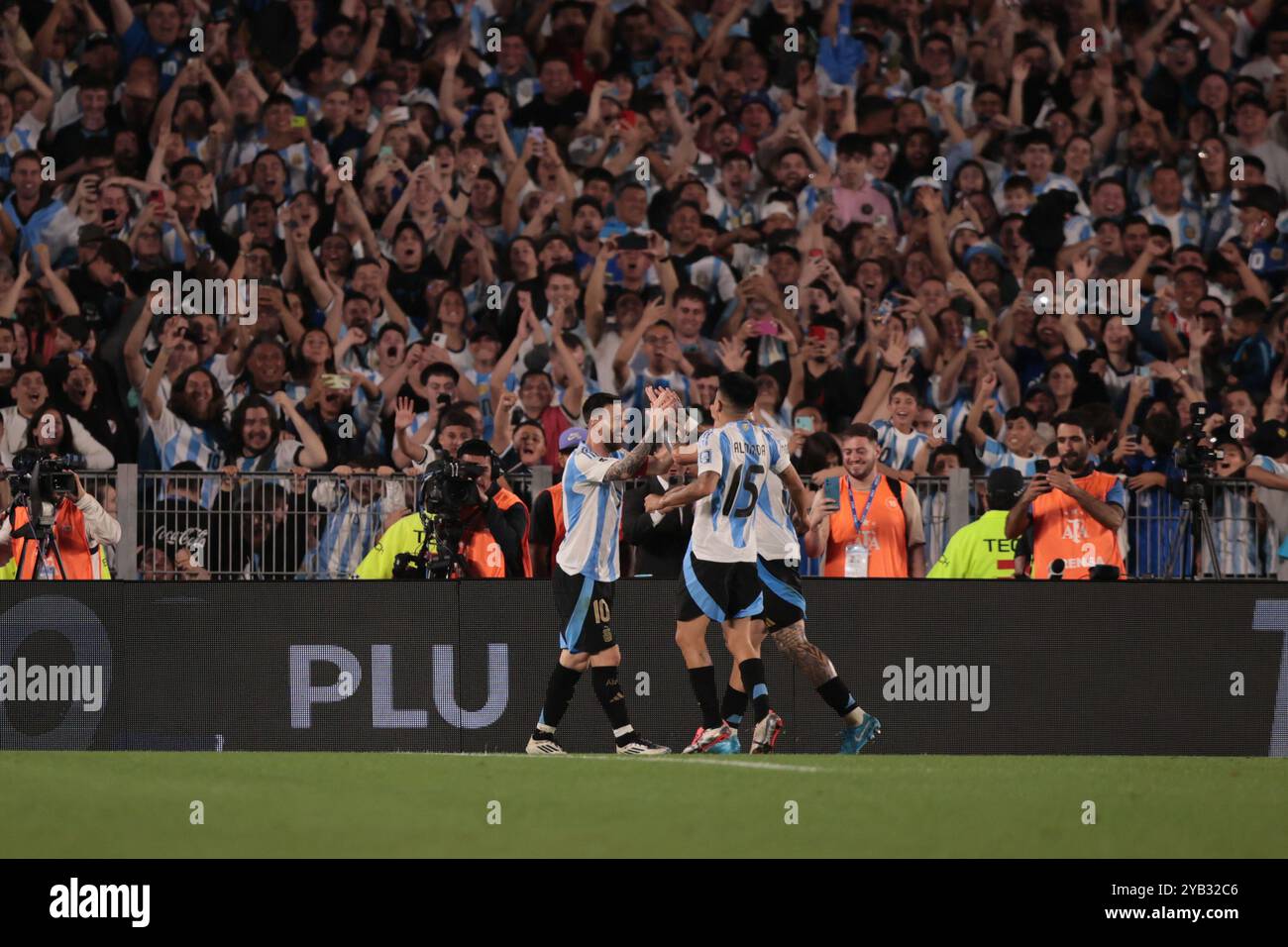 Lionel Messi (L) celebrates his goal against Bolivia. Argentina's ...