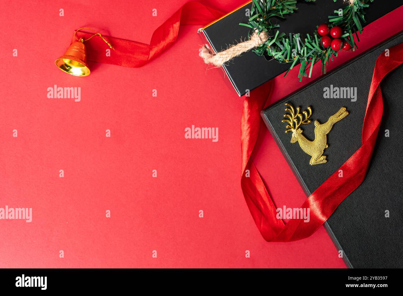 Christmas-themed gift boxes on a red background with decorations Stock ...