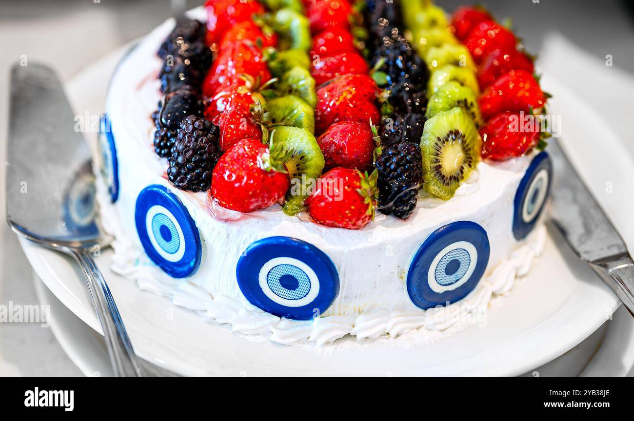 Turkish cake with berries and nazar design Stock Photo - Alamy