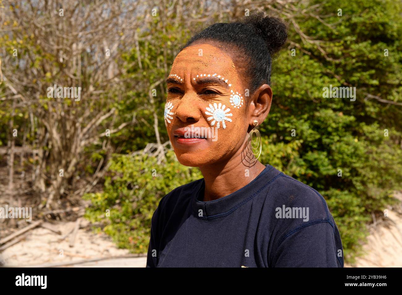 The Three Bays, coast near Antsiranana. Woman with traditional facial ...