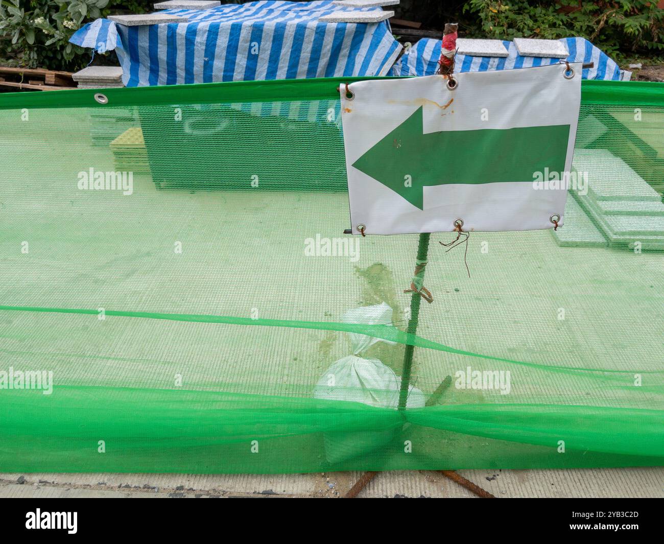 The arrow symbol for the direction on the new concrete walkway for ...