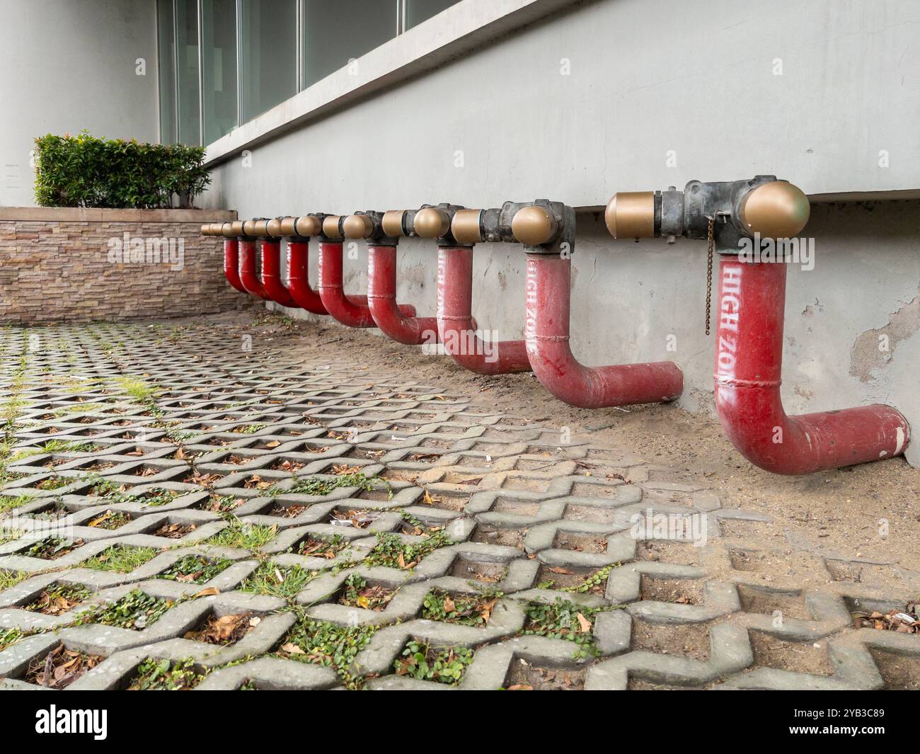 The fire hydrants are lined up on the side of the office building for ...
