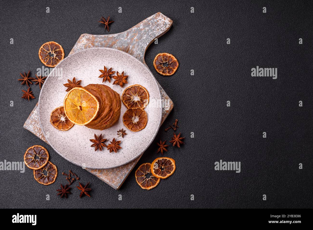 Sweet craffin made from puff pastry with Swiss meringue on a dark ...