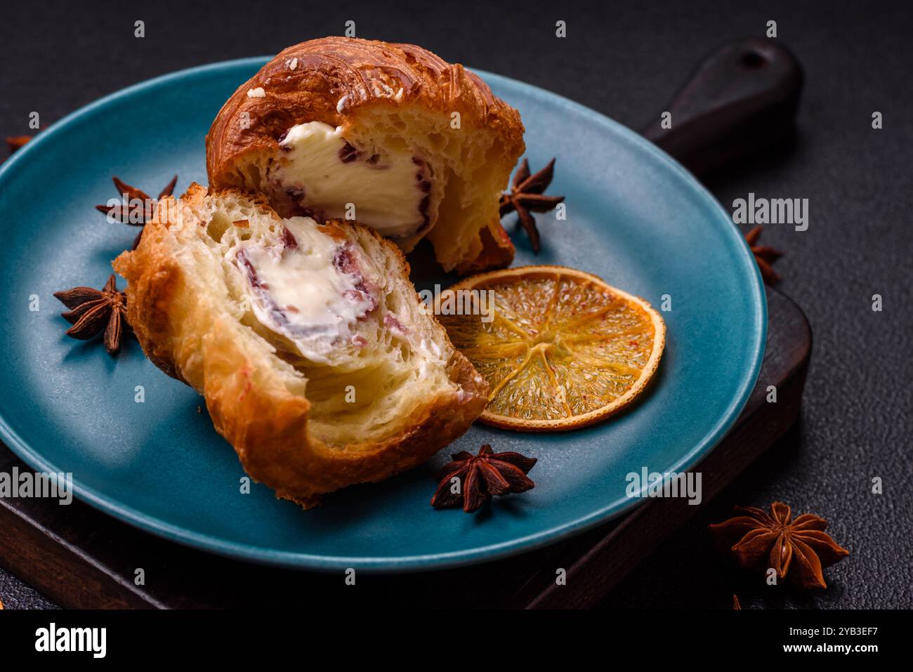 Sweet craffin made from puff pastry with Swiss meringue on a dark ...