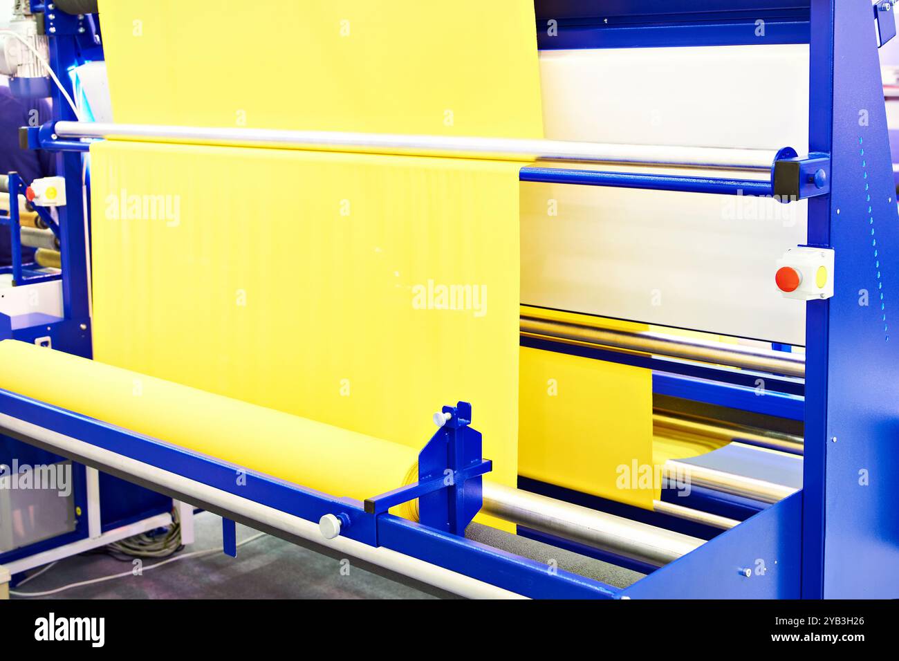 Measuring fabric inspection machine in the workshop Stock Photo - Alamy