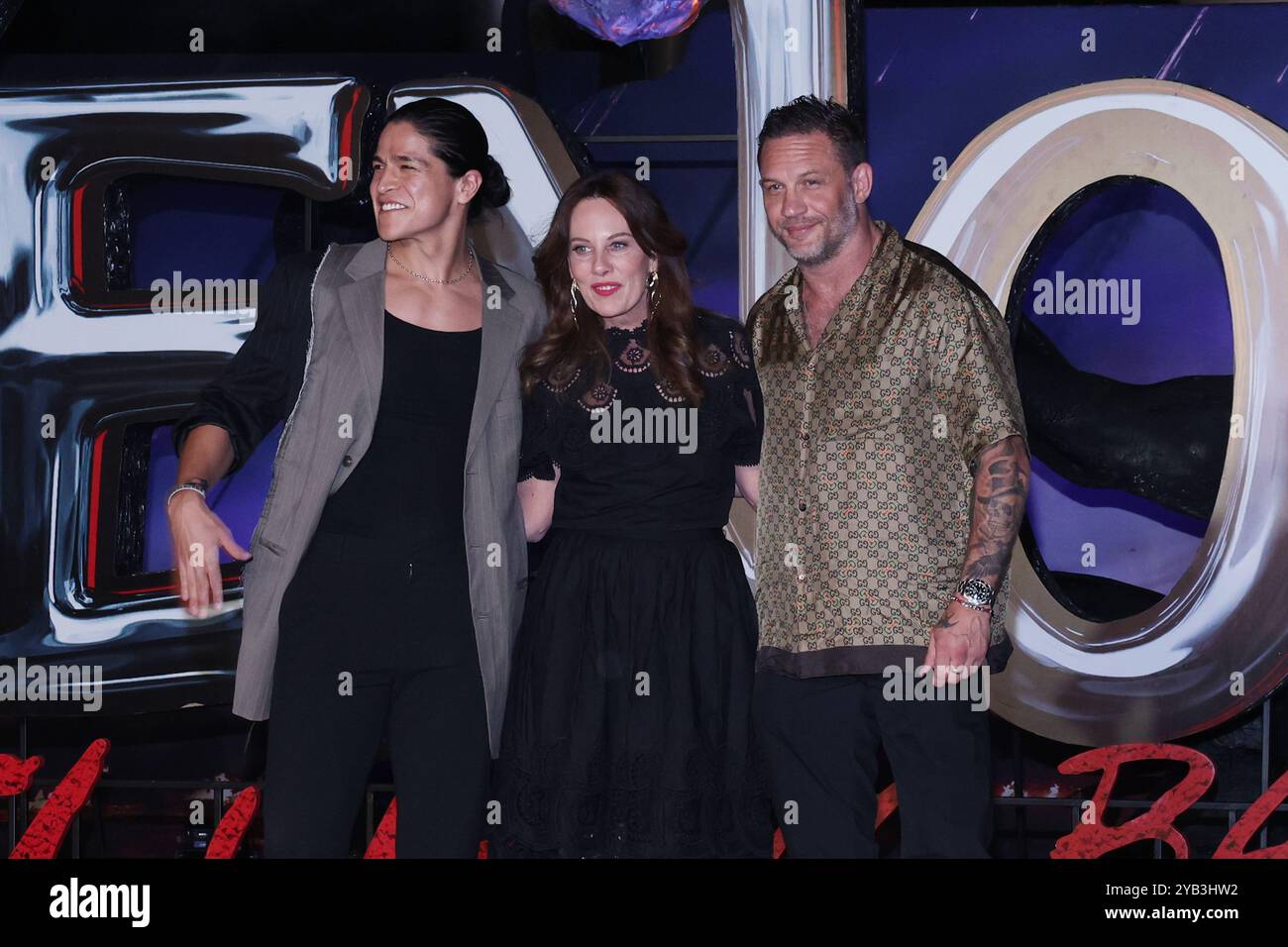 Tom Hardy, Kelly Marcel, and Cristo Fernandez attend the black carpet ...