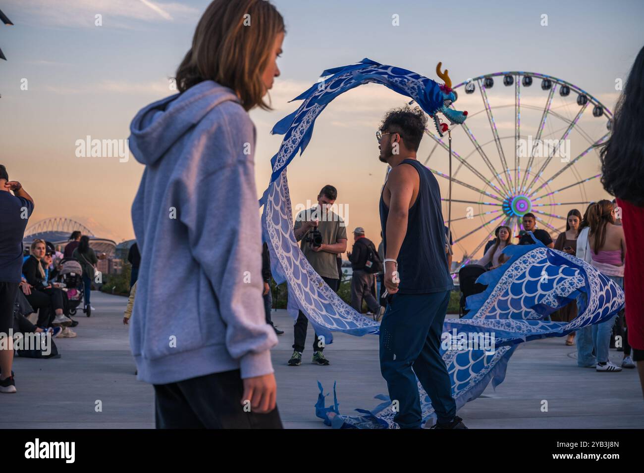 Seattle, USA. 13th Oct 2024. Chinese Dance Dragon Ribbon at sunset from ...